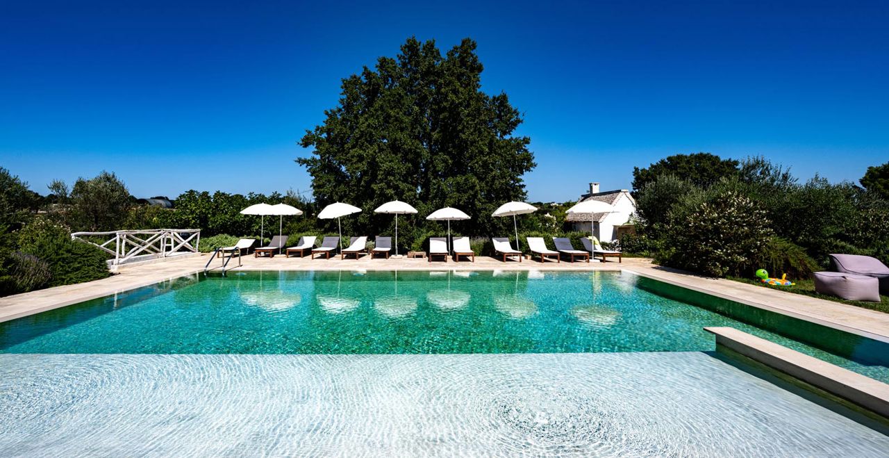 Enjoy relaxation and privacy at Leonardo Trulli Resort's swimming pool